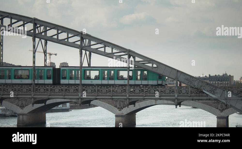 A Train Ride Crossing Over The Bridge In Paris, France. Static Shot ...