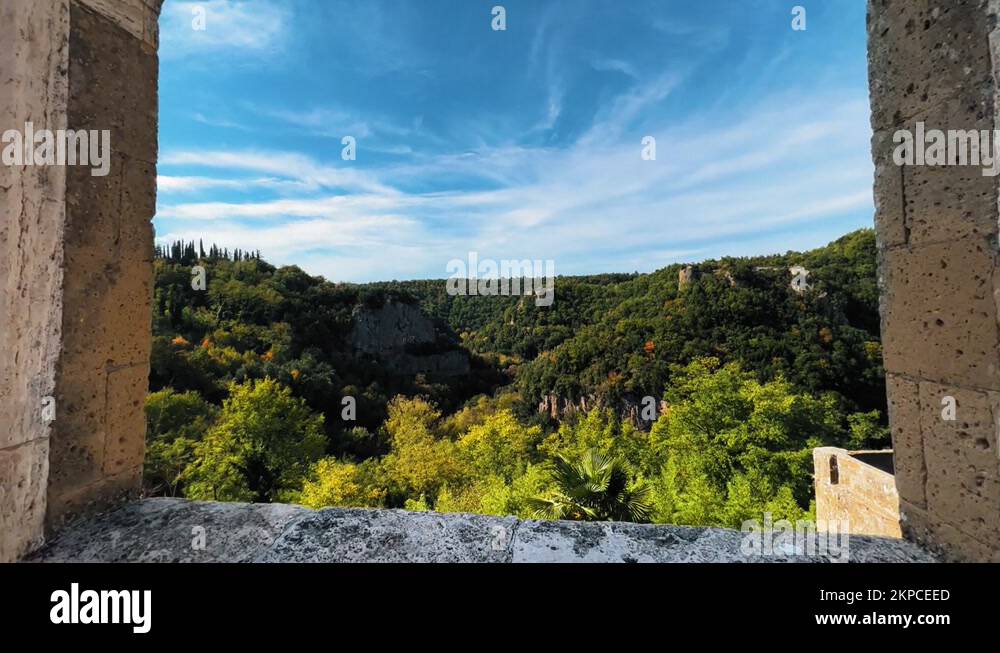 Dolly forward walk through window of old buildings with idyllic ...