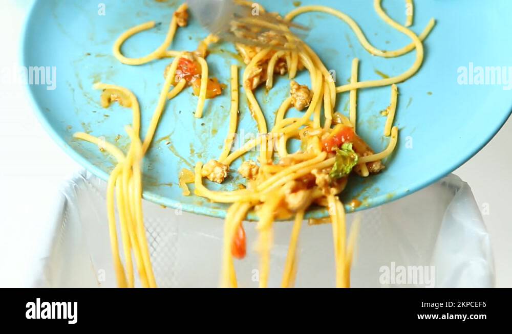 Man is throwing away food waste to the bin, in studio Chiangmai ...