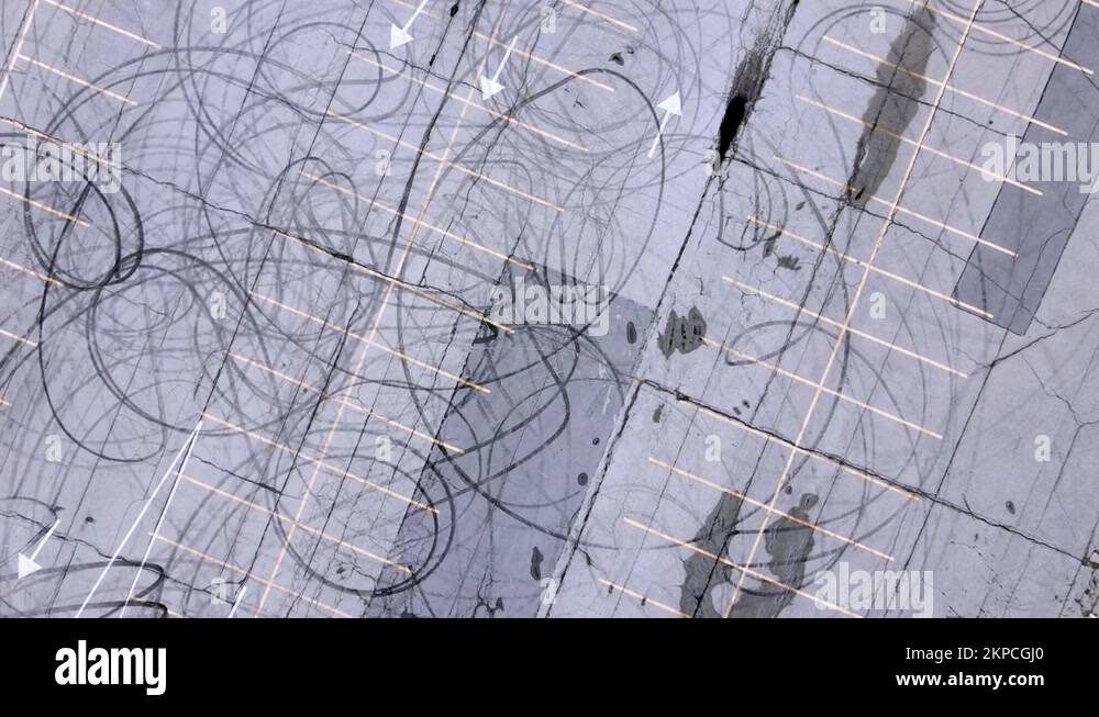 Drone descent to pavement showing skid marks and mutliple tyre marks on ...