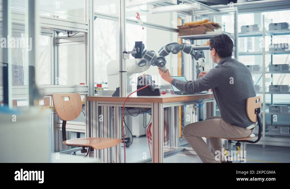 Engineer Control Robotic Arm With Control Panel Stock Video Footage - Alamy