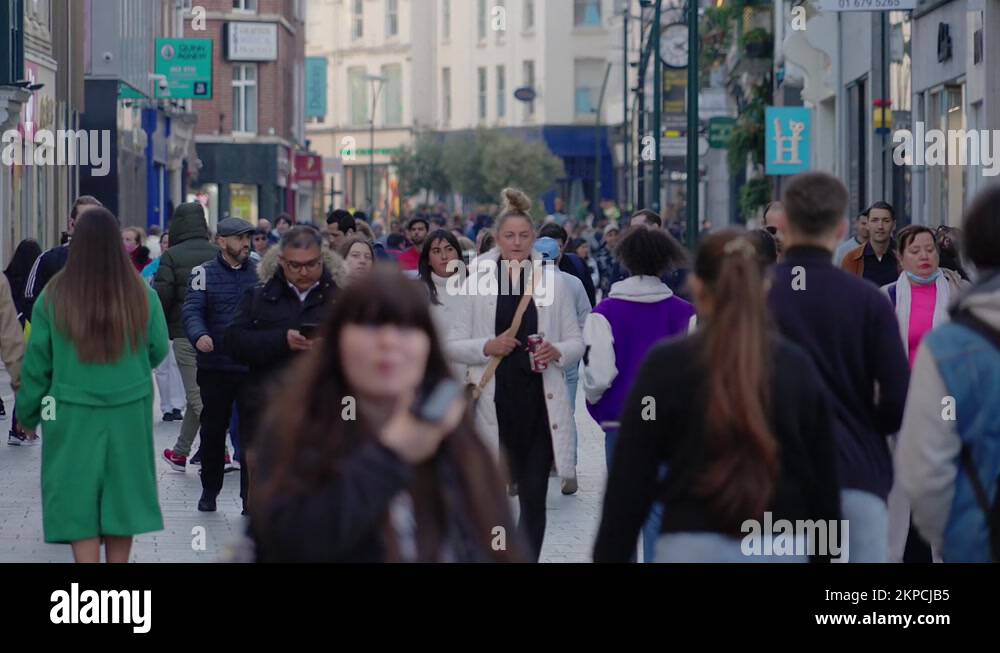 Crowd of people walking through a busy pedestrian zone - Grafton Street ...