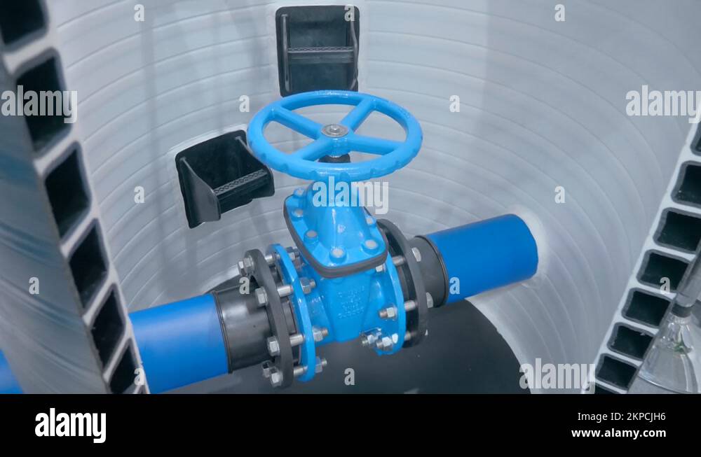 An example of a modern building of a water well with a pipe and a water ...