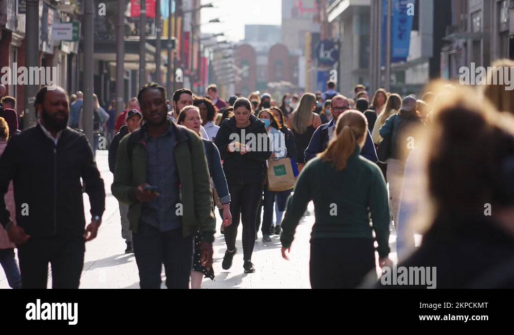 Crowd of people walking through a busy pedestrian zone - Grafton Street ...