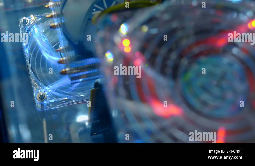 Transparent, shiny сooling fans of the computer unit are turning and ...