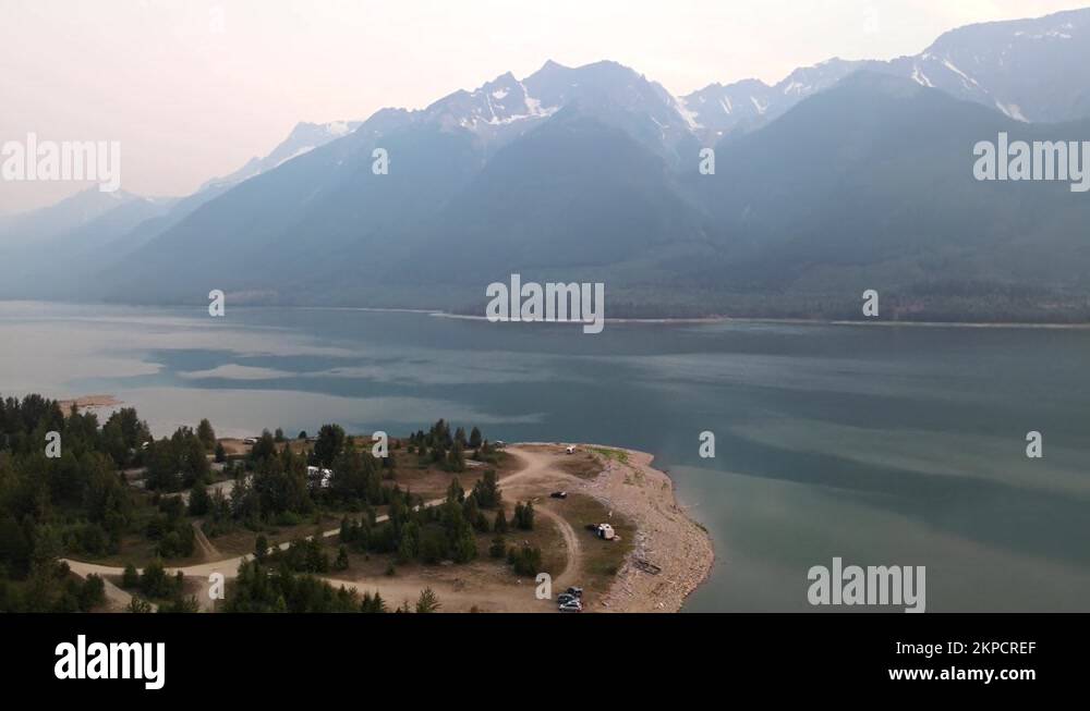Rocky Mountains towering over the stunning Kinbasket Lake in Canoe ...