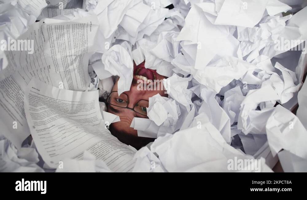 Buried under paper Stock Videos & Footage - HD and 4K Video Clips - Alamy