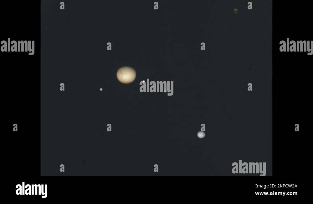 1960s: Model of solar system lit by lights, surrounded by dark. Planets ...