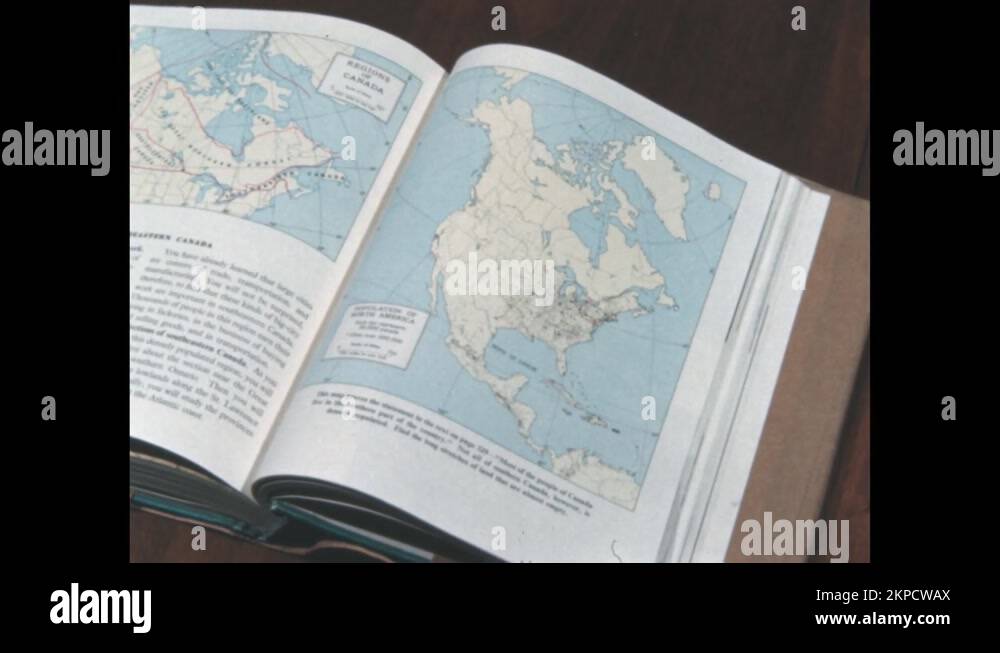 1960s: Hand flips through pages of book. Clapboard. Hand turns pages ...