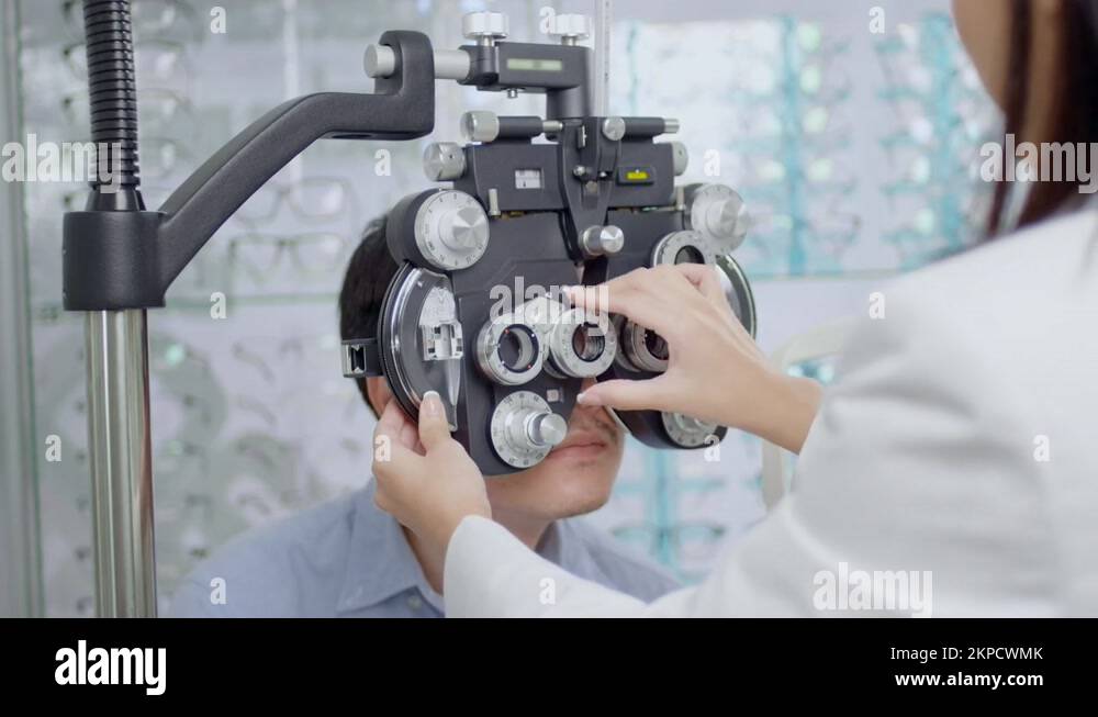 Young male customer being examined visual test using Bifocal Optometry ...