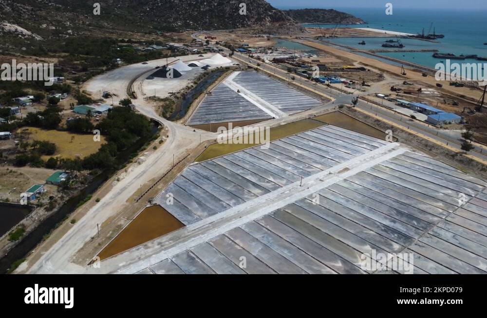 Birds eye view of vast salt flats harvesting sodium chloride, spread ...