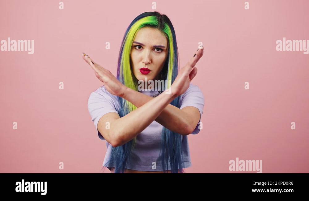 Strict rejection concept. Young woman with rainbow hairstyle making ...