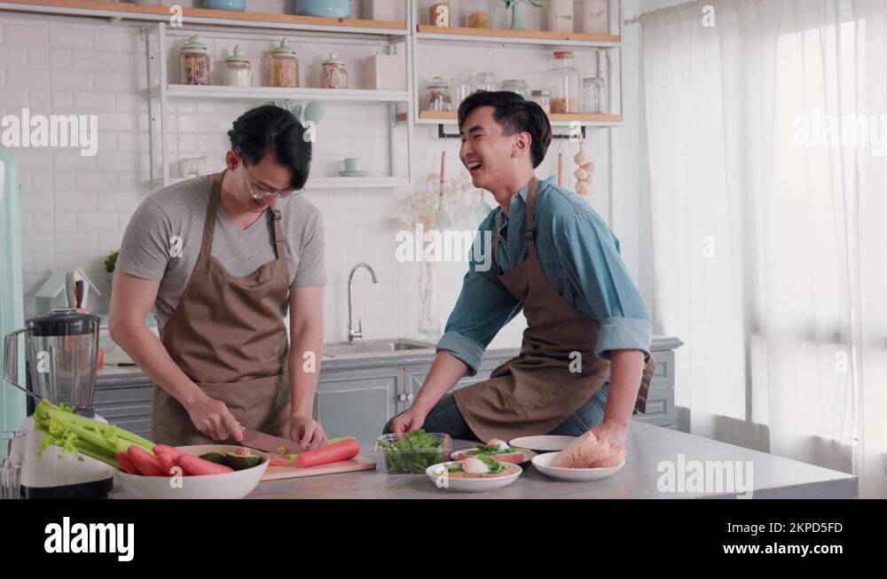 Asian Gay Couple Tease Each Other Very Happy And Romantic In Their Home Kitchen Stock Video