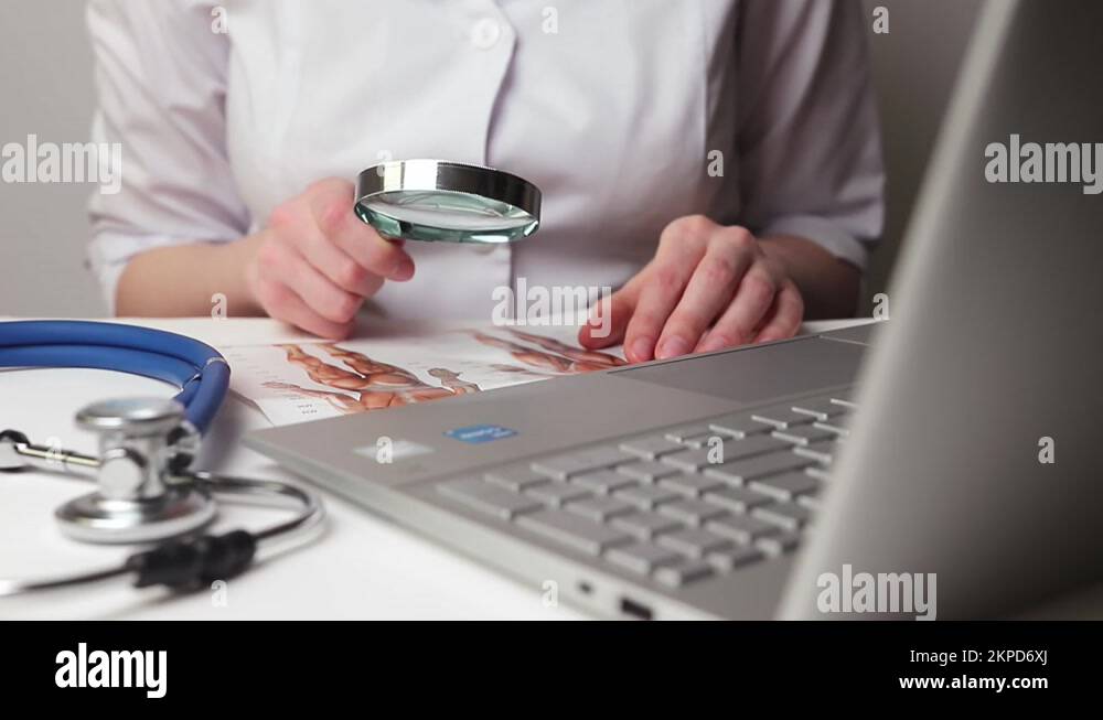 Doctors hands analyzing human body anatomy at work, close up hands with ...
