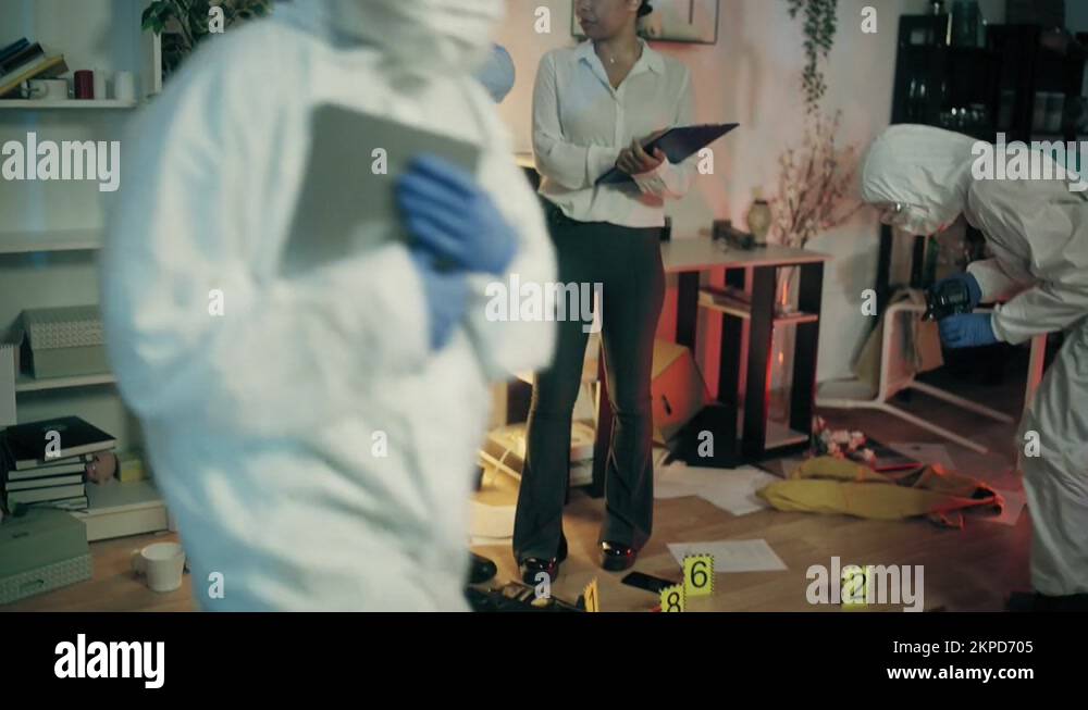 Detectives working on murder investigation at crime scene, evidence ...