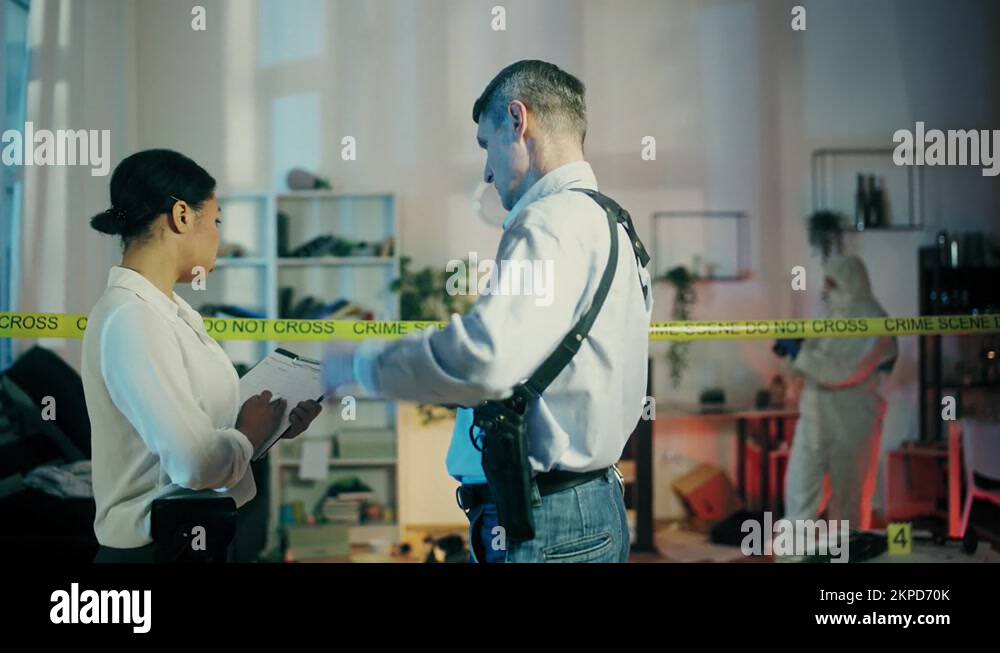Police officers working at crime scene, murder investigation ...