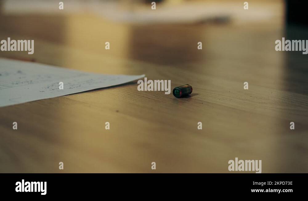 Fired bullet case falling on the floor, killing somebody, crime scene ...