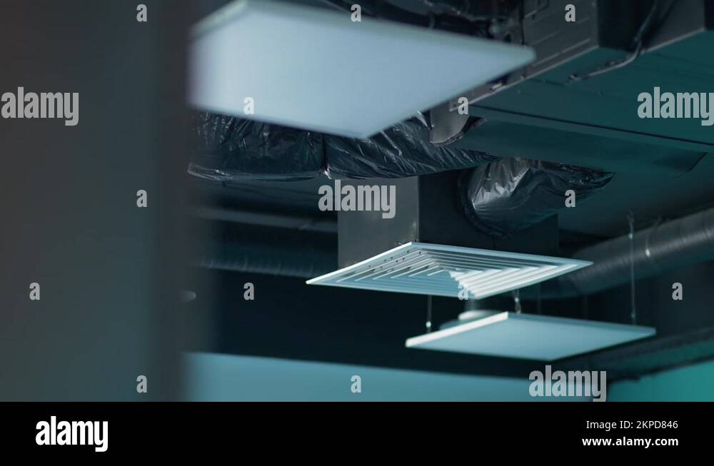 Handheld, view of the ventilation and lighting system of office ...