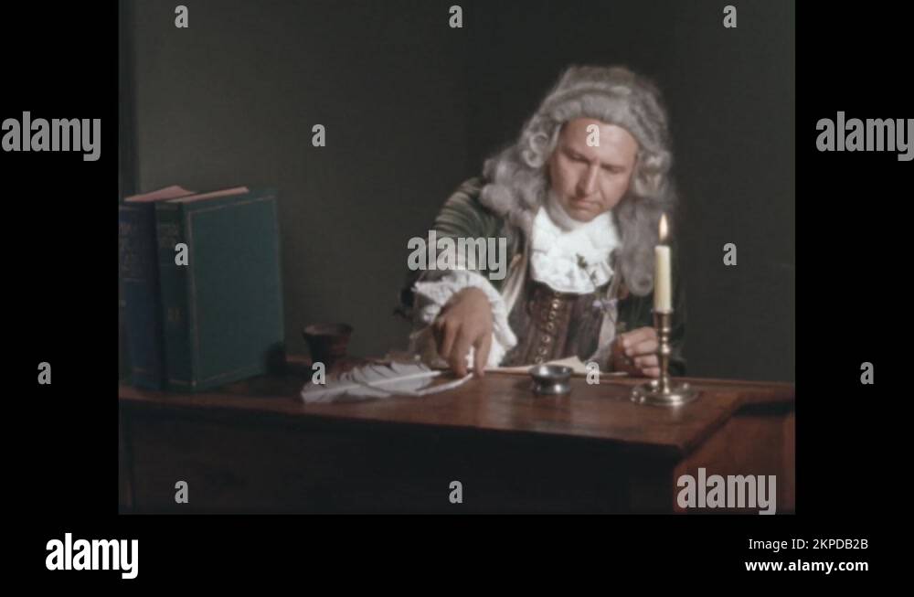 1950s: man in period costume works at desk. Man in wig writes with ink ...