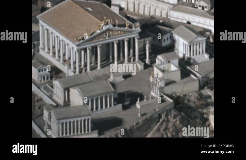 100 BC: Model of buildings, colonnades, arches, columns. Man wears tie ...