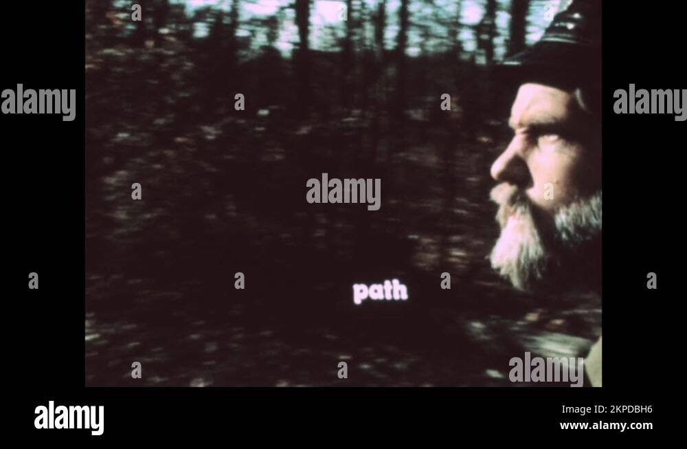 1970s: Boy sitting in tree. Man walking along pathway, word 'path' and ...