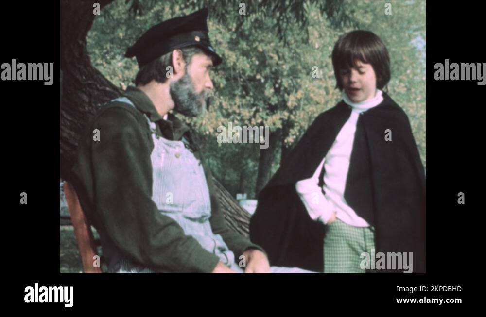 1970s: Kids in the park talking, they suddenly disappear. Boy talking ...