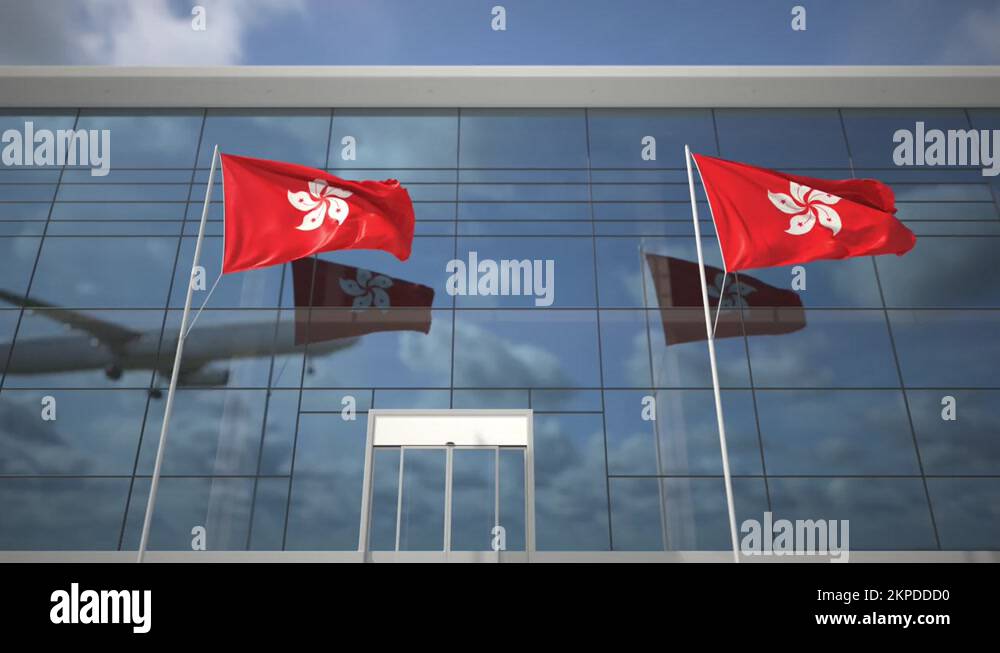 Landing airliner and flags of Hong Kong in the airport terminal Stock ...