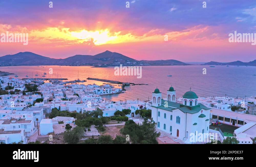 Greek island Paros sunset aerial view. Sun rays through sky clouds and ...