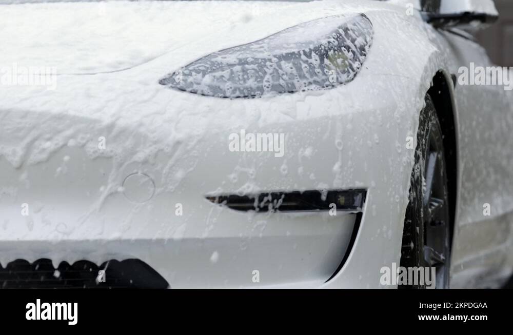 Tesla Model 3 gets a car wash on the front end Stock Video Footage - Alamy