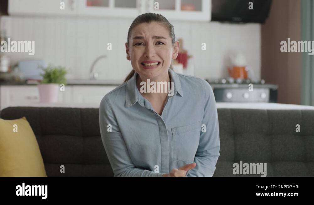 Young woman arguing and shouting angrily reacts to her lover or husband ...