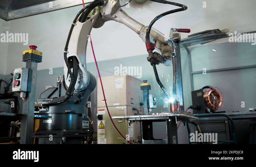 Modern Welding arm is operating at the medical equipment manufacturing ...