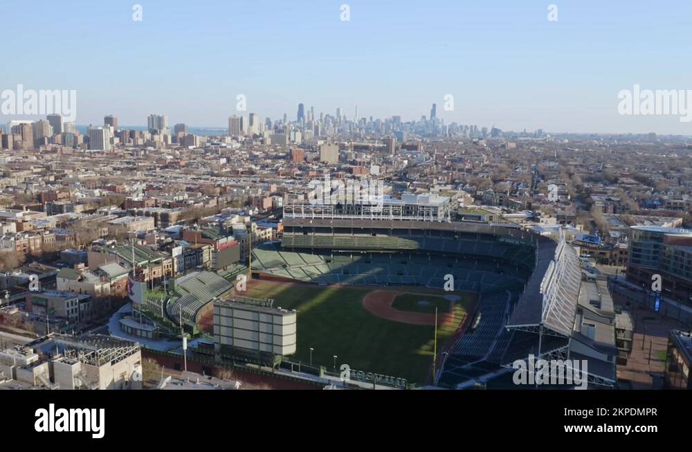Wrigley Field Revealed by Drone Pullback. Chicago, Illinois Skyline in ...
