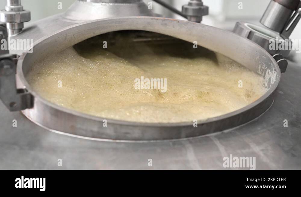 Beer brew tank with boiling malt Stock Video Footage - Alamy