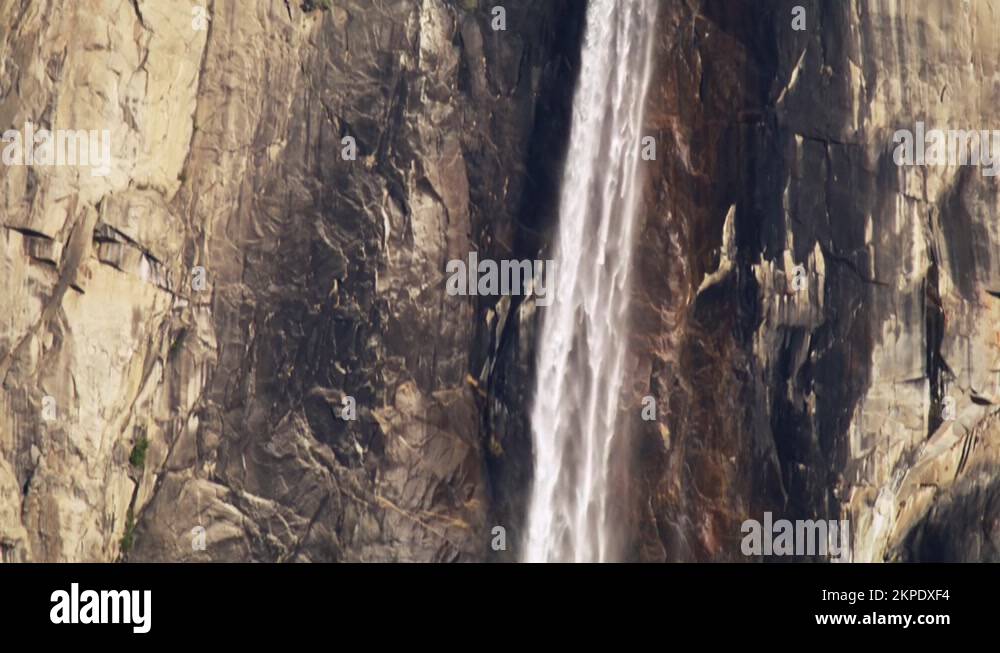 RED camera following water flow from top to base of sheer cliff ...