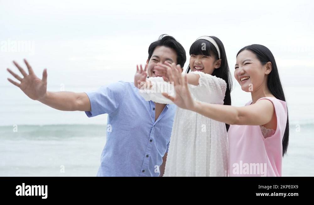 Holiday concept of 4k Resolution. Family waving goodbye together at sea ...