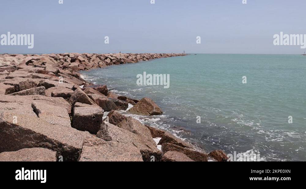 Rock breakwater pier ocean water bay beach Gulf of Mexico Texas 4K ...