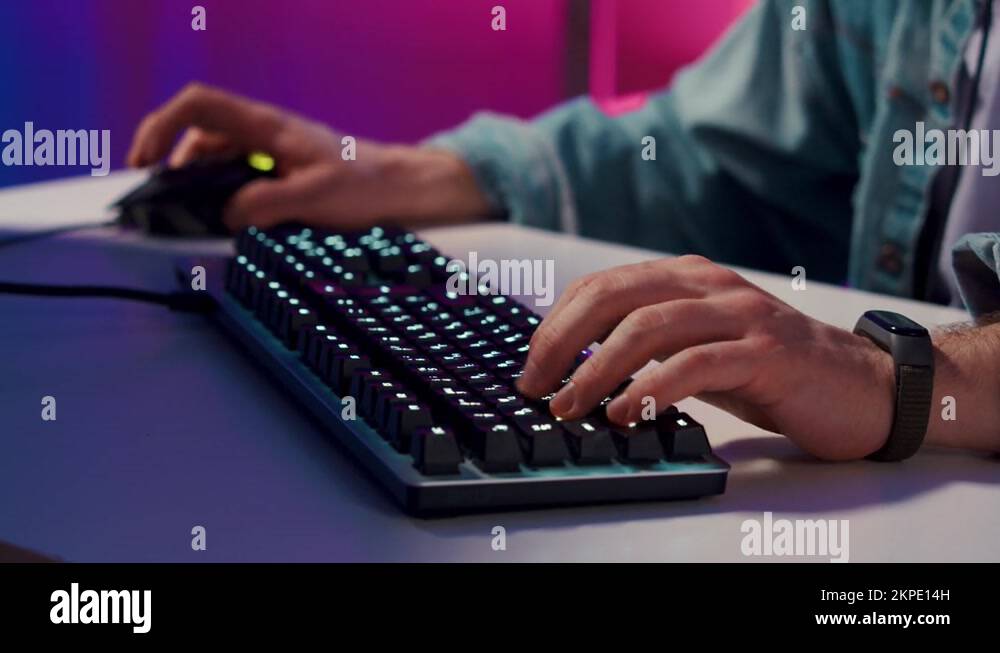 Close-up on Hands man Gamer Playing in Video Game Using Keyboard. Male ...