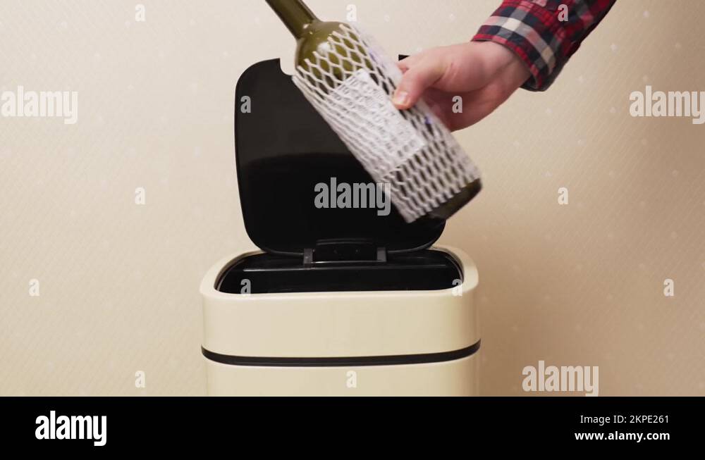 a man's hand throws a glass bottle into a Sensory trash can Stock Video ...