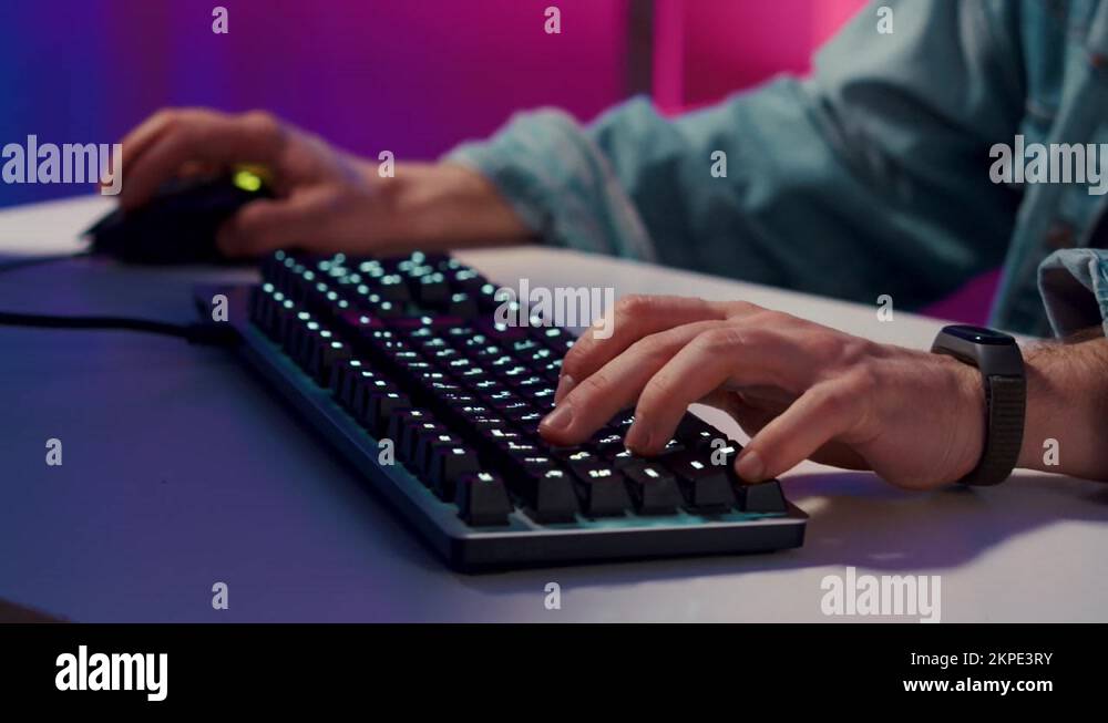 Close-up on Hands man Gamer Playing in Video Game Using Keyboard. Male ...
