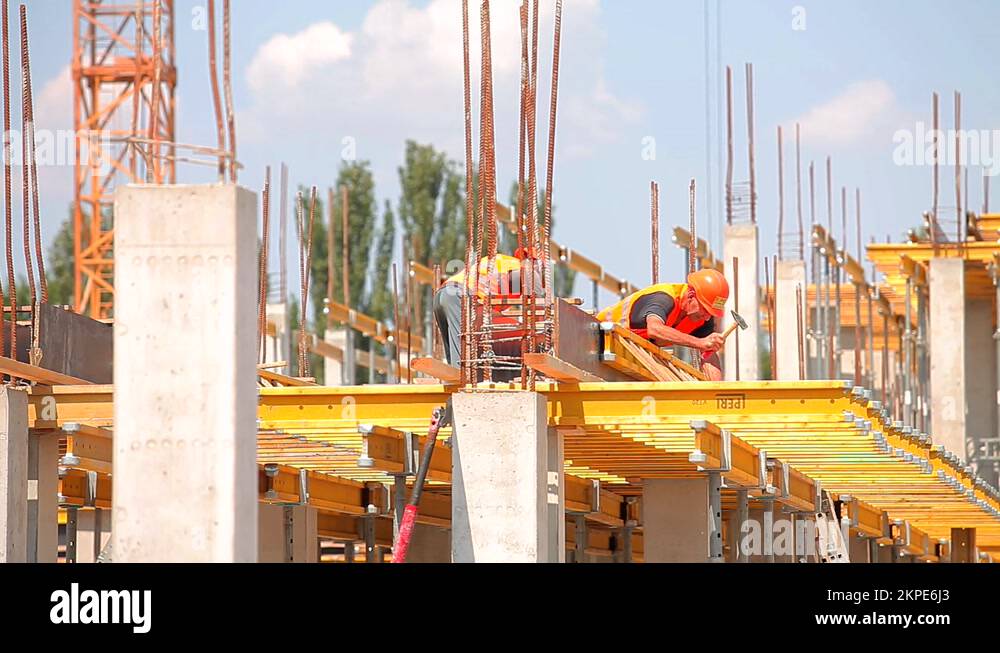 Builders make formwork at the construction site. Construction process ...