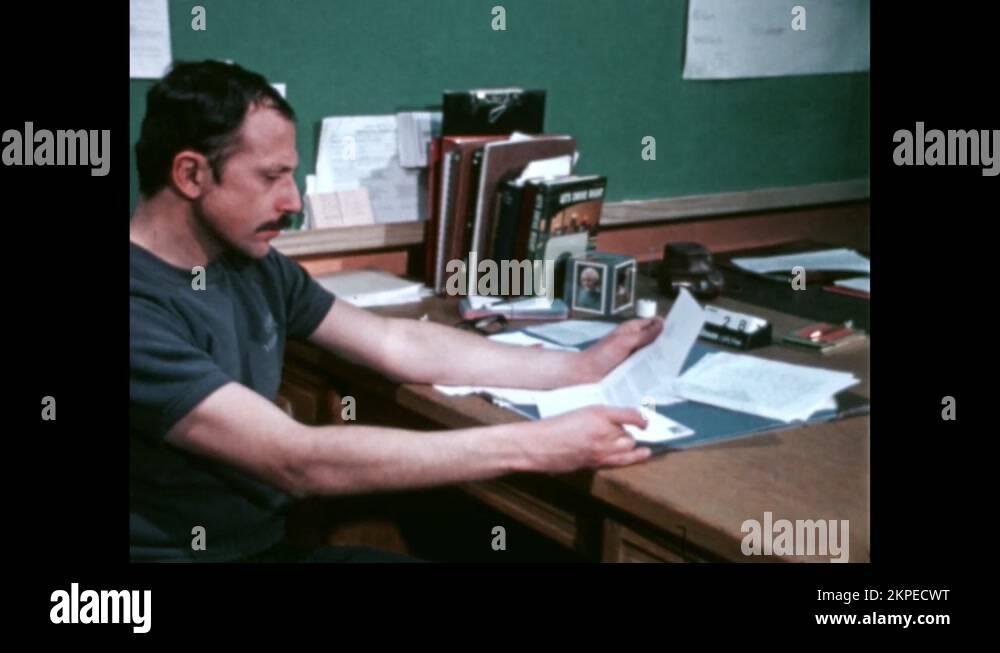 1970s: Writing Better Business Letters. Man at desk. Postage stamps. 8c ...