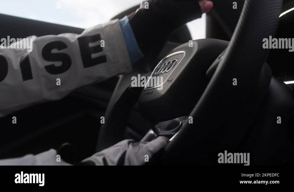 Female Driver's Hands On The Steering Wheel Of An Audi Car. close up ...