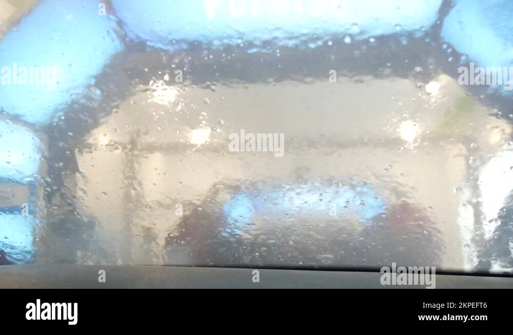 Washing the car in an automatic car wash, view of the inside of the car ...