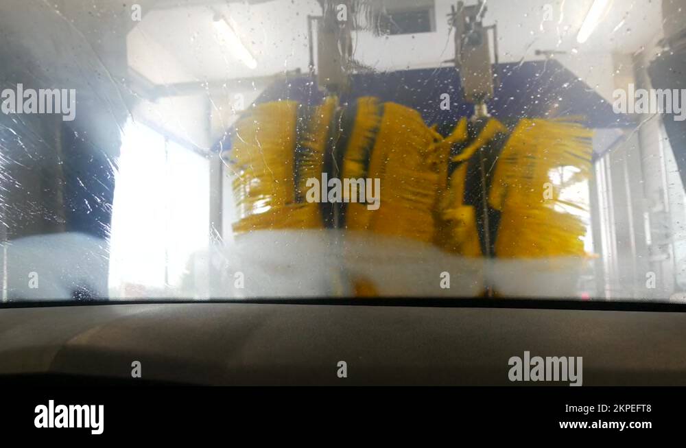 Washing the car in an automatic car wash, view of the inside of the car ...