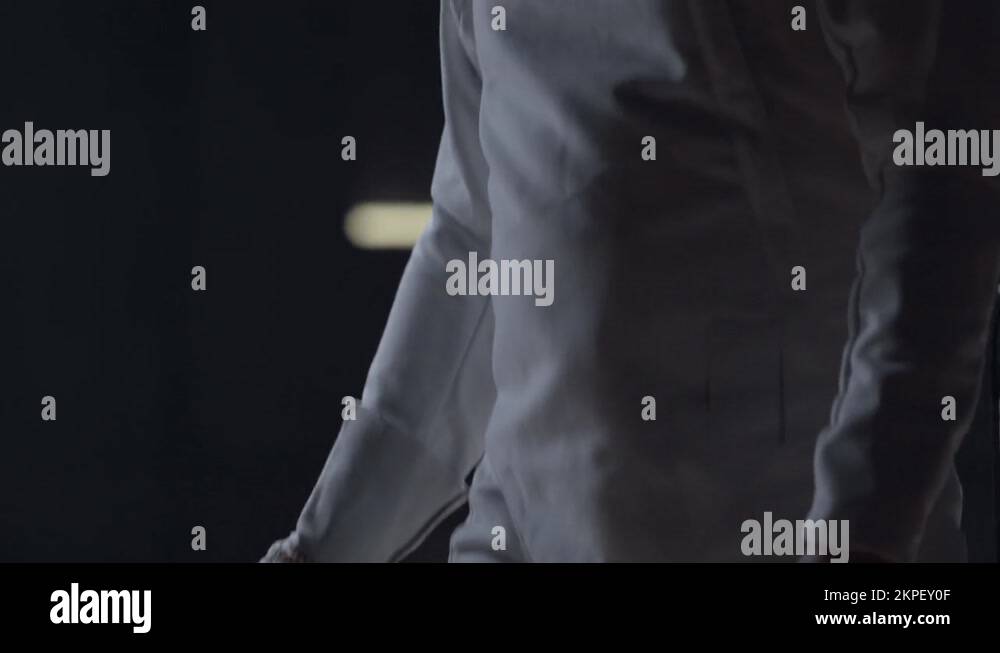 Professional male fencer takes a starting pose before the fight Stock ...
