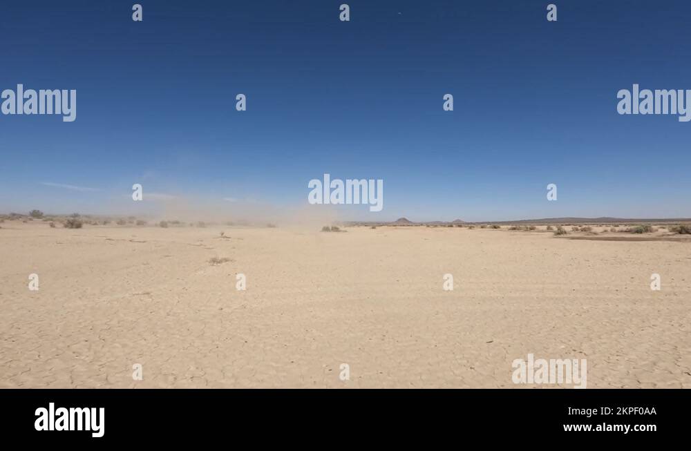 Driving off-road and lost through the Mojave Desert on a windy, dusty ...