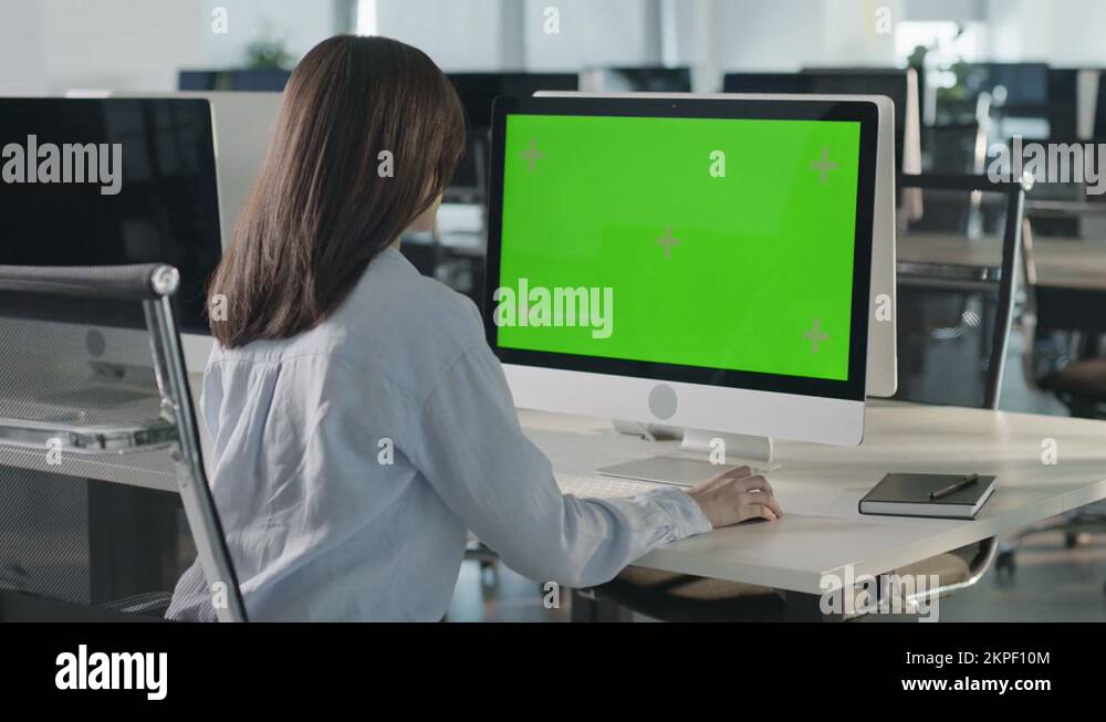 Asian Business Woman Typing on Desktop Computer with Green Mock-up ...