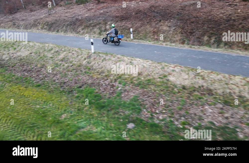 A moped rider Stock Videos & Footage - HD and 4K Video Clips - Alamy