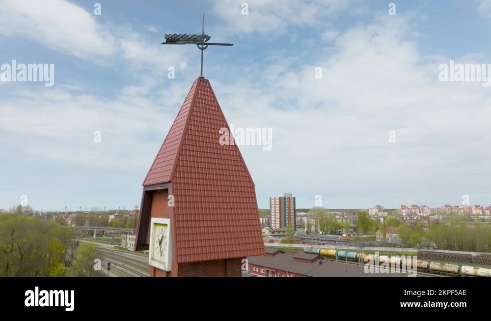 Train station tower with built-in clock and lightning rod located in ...