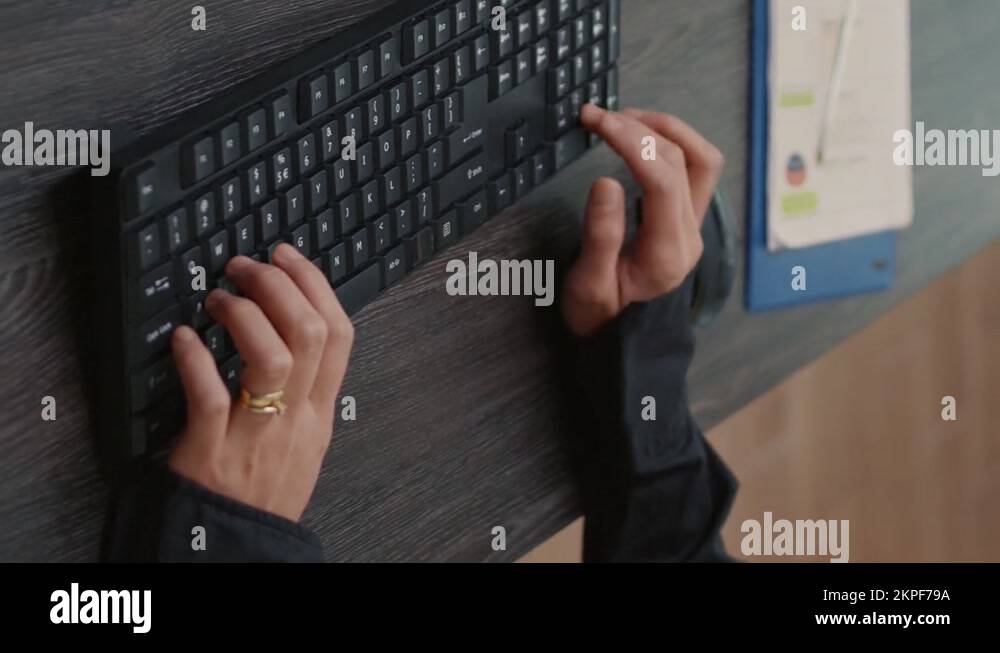 Vertical Video Focus On Programer Hands Typing Code On Keyboard While Looking At Stock Video